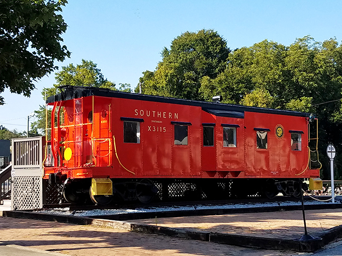 That red Southern caboose isn't just eye candy—it's a rolling history lesson parked permanently for your nostalgic pleasure.