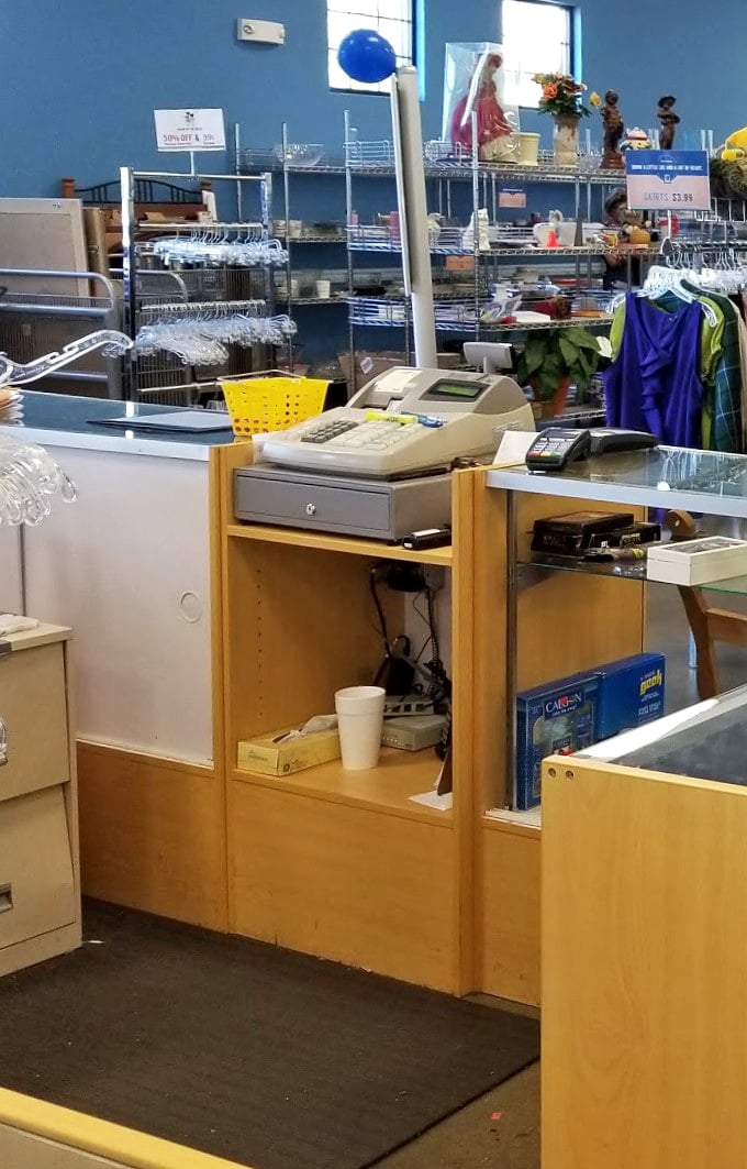 Where retail meets mission: This unassuming checkout counter transforms purchases into community support with every transaction.