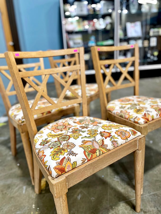 Dining chairs with stories to tell, their floral cushions whispering tales of countless Sunday dinners past.
