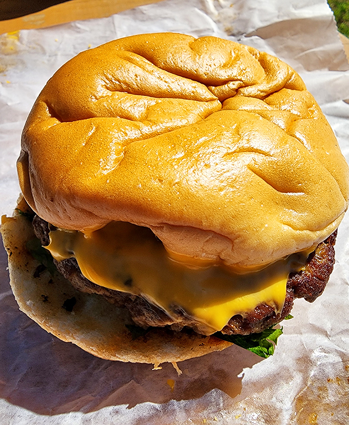 Pierce's juicy cheeseburger on a soft bun &ndash; a perfect alternative when you need a break from their legendary barbecue offerings.