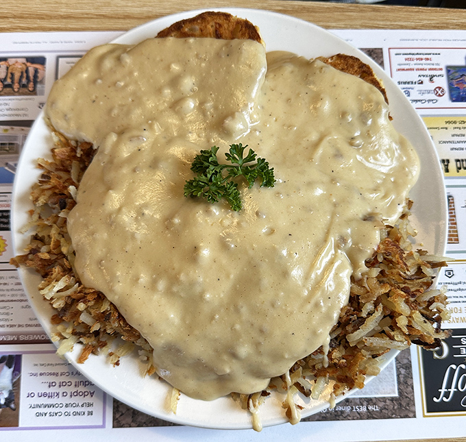 Biscuits and gravy that would make your grandmother both jealous and proud &ndash; a golden lake of country gravy hiding treasures beneath.
