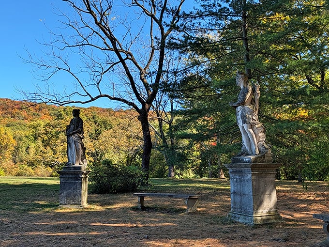 Classical statues standing guard in the gardens, silently judging your cargo shorts while offering timeless elegance to selfie backgrounds.