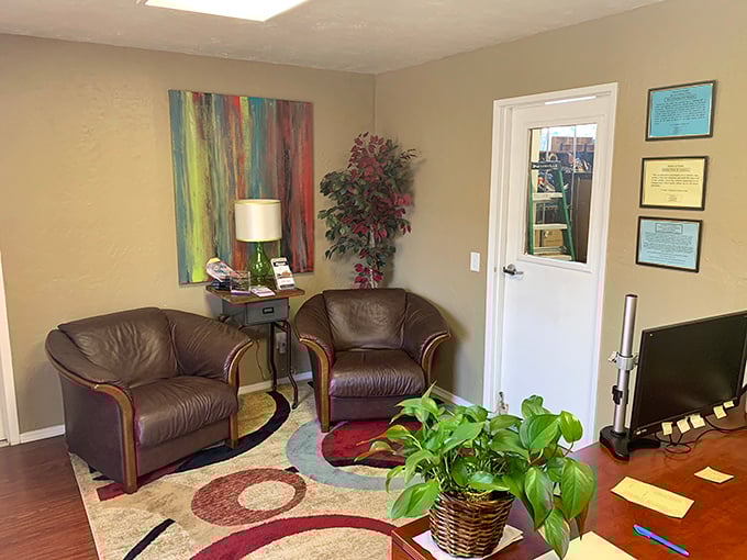 The client reception area: where auction dreams begin. Those leather chairs have heard more bidding strategies than a poker tournament.