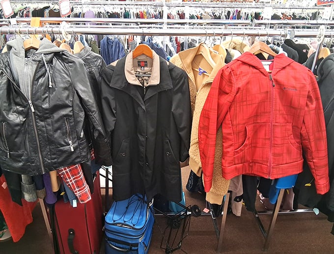Winter coats hang like colorful sentinels, protecting future owners from Michigan weather at fraction-of-retail prices.