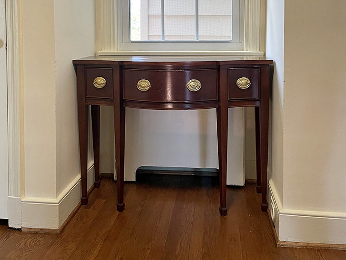 The elegant simplicity of this corner table proves that sometimes less is more&mdash;unless we're talking about antique shopping time.