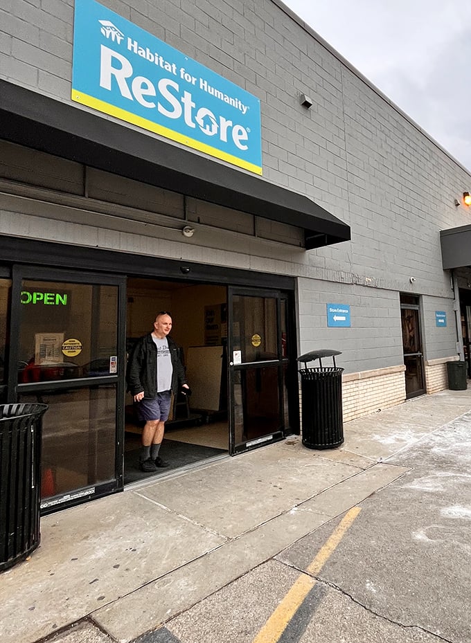 Another happy hunter exits with treasures, probably already planning their triumphant return visit for next weekend's fresh inventory.