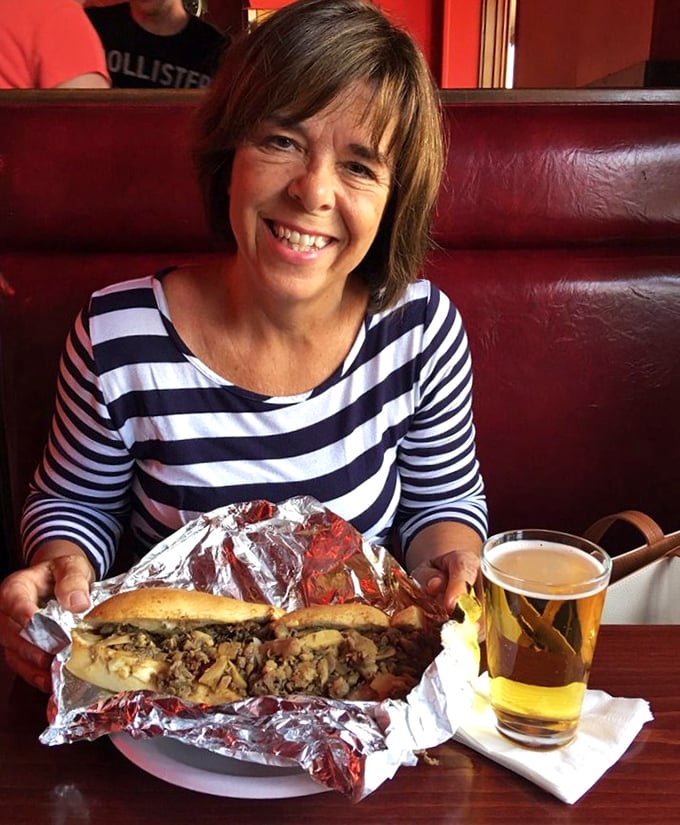 A patron enjoys the fruits of Max's labor&mdash;that look of anticipation says everything about what's waiting in that foil wrapper.