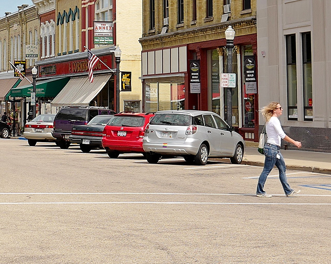 Historic buildings stand shoulder to shoulder like old friends who've weathered every storm together and still show up.