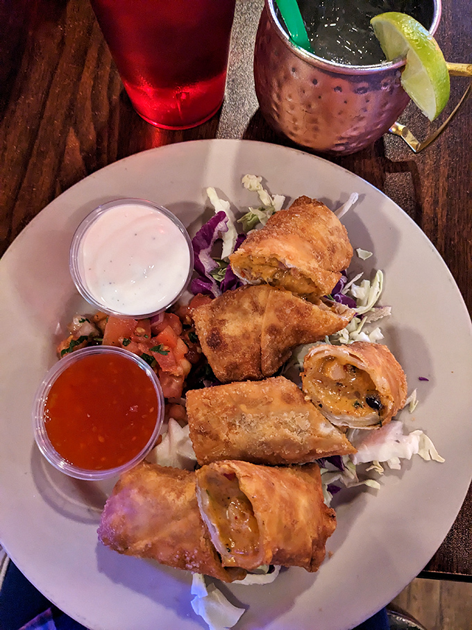 Golden, crispy egg rolls that shatter like your willpower when dieting. Served with tangy dipping sauces and that Moscow Mule isn't just for show.