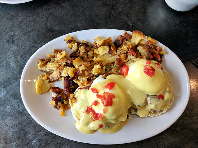 Eggs Benedict that makes you question all other breakfast commitments. Those home fries on the side aren't just playing backup&mdash;they're staging a delicious rebellion of their own.