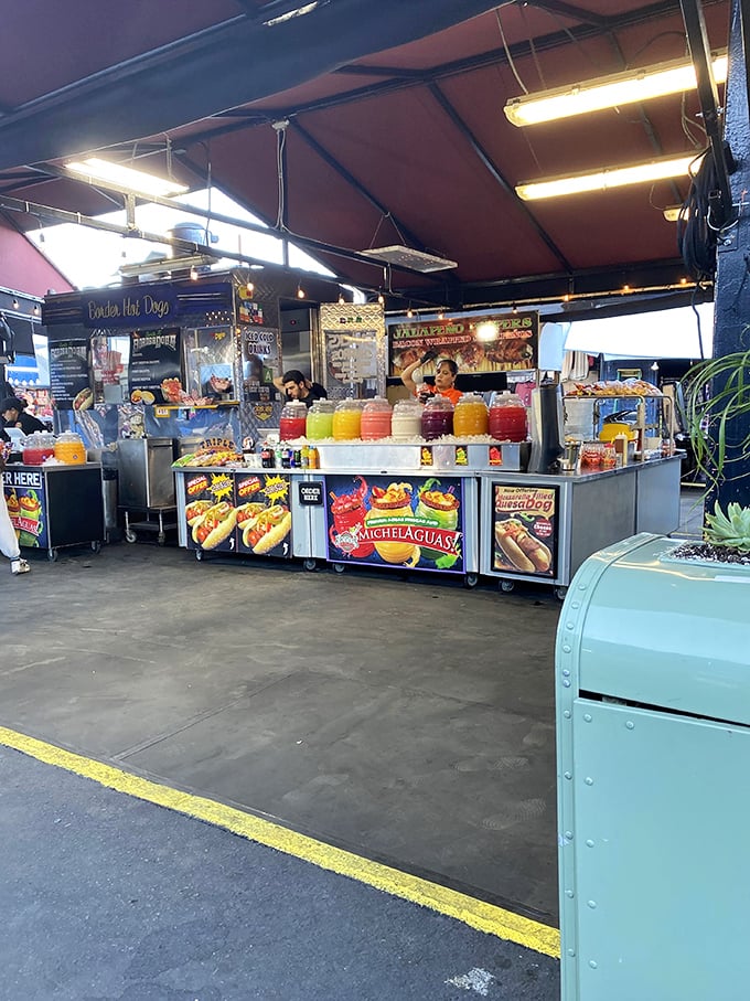 Hot dog heaven meets aguas frescas paradise. The real dilemma isn't what to eat, but how to hold it all while shopping.