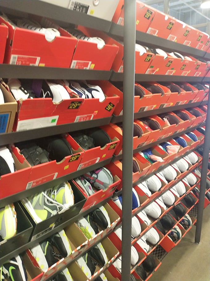 Sneaker heaven organized in those iconic orange boxes. Each pair tells a story your feet are dying to narrate.