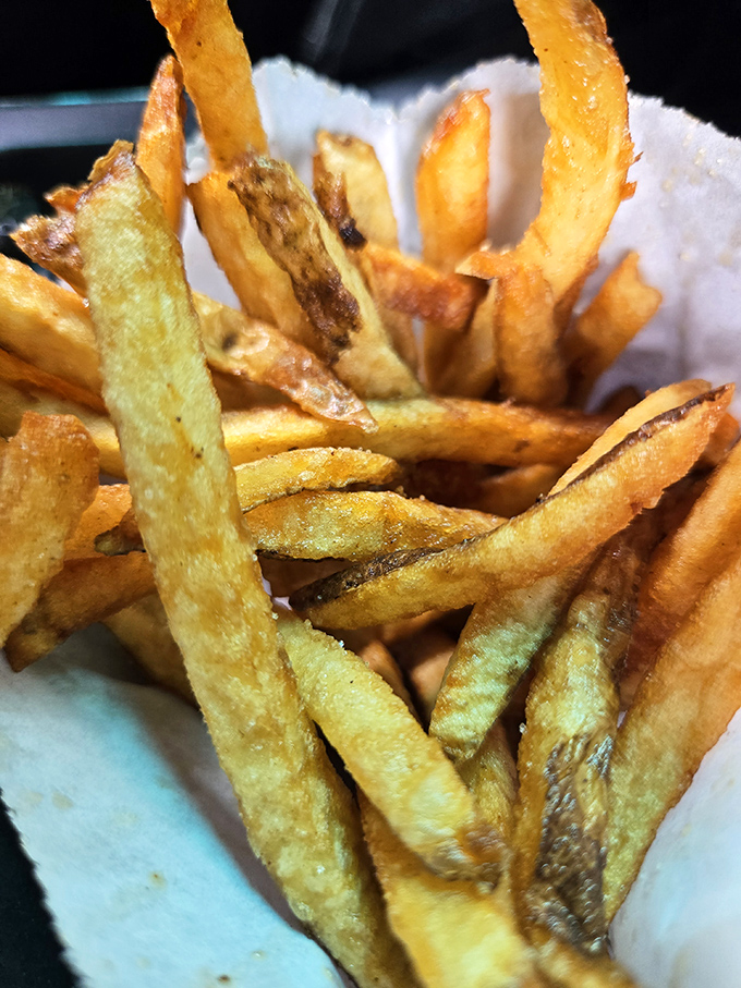 Golden, hand-cut fries with that perfect crisp-outside-fluffy-inside ratio that fast food chains have been trying to replicate for decades.