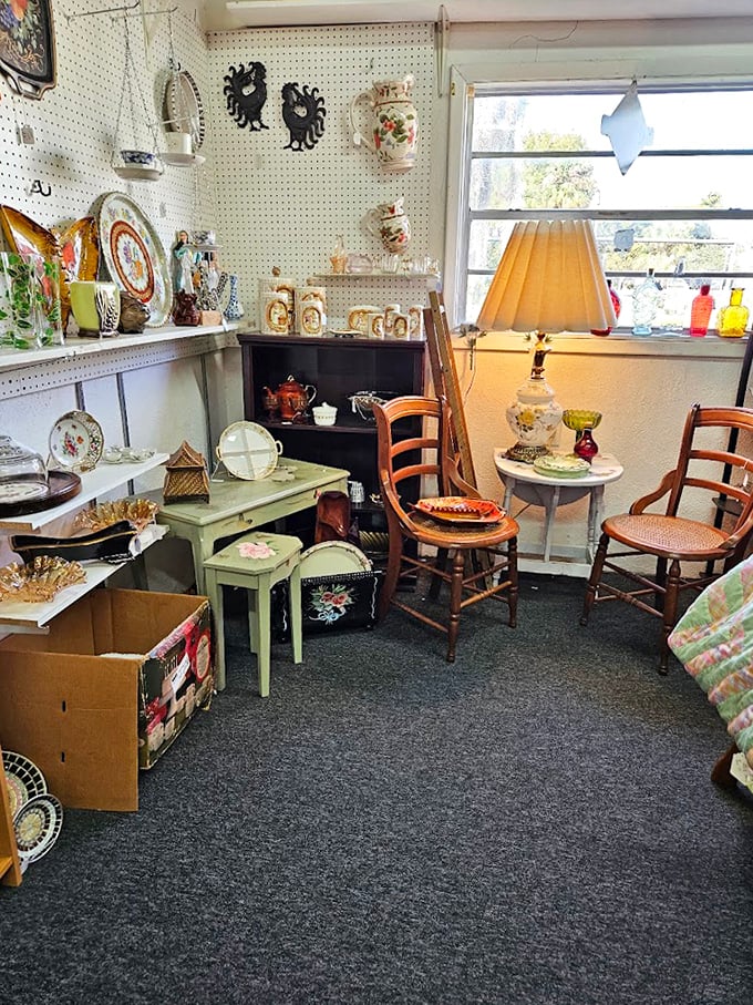 A perfectly staged vignette that whispers, "Sit a spell." That mint green table and vintage chairs are just waiting for someone to serve imaginary tea.