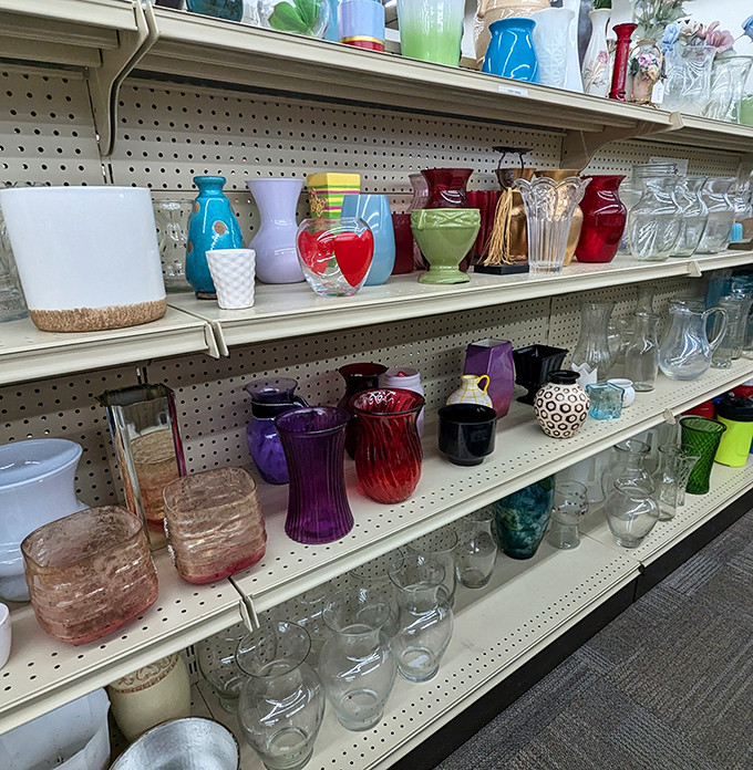 A rainbow of glassware catches the light, each piece telling silent stories of dinner parties and special occasions from homes past.