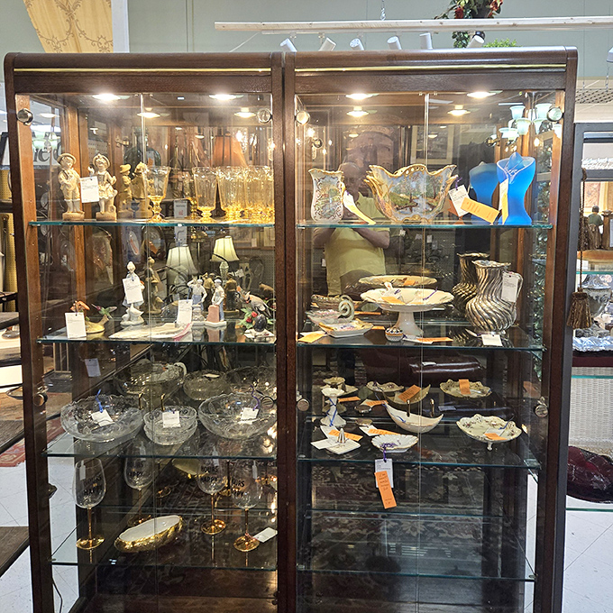 Behind glass doors, delicate treasures wait patiently&mdash;each piece of crystal and porcelain whispering stories of elegant dinner parties from bygone eras.