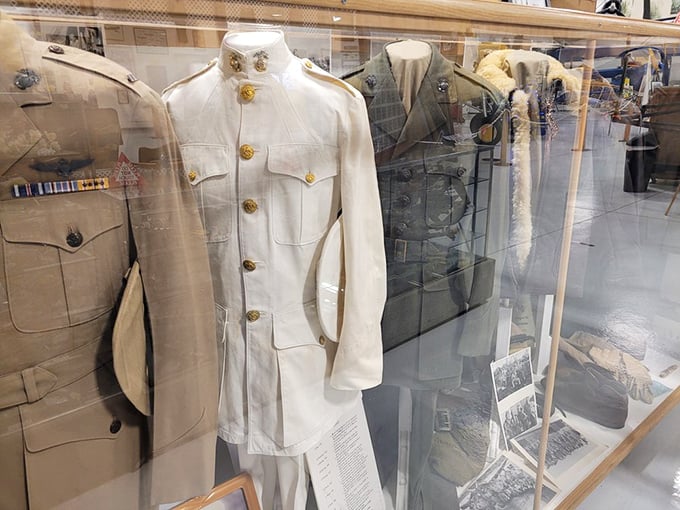 Military uniforms standing at eternal attention. Each stitch and button tells a story of service that makes your work uniform complaints seem rather trivial.