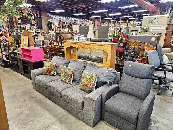 The living room section looks like a comfortable waiting room for second chances. That gray sofa is practically begging for a Netflix marathon.