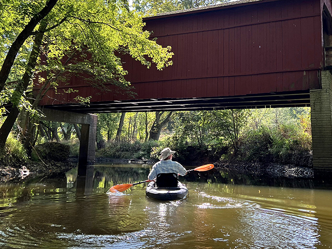 The bridge offers kayakers a unique perspective&mdash;paddling beneath history while the creek provides nature's own guided tour.
