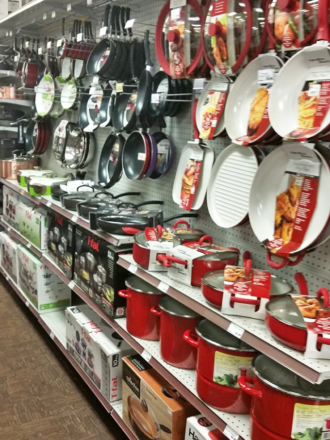 Cookware heaven awaits kitchen enthusiasts with rows of colorful pots and pans. Red cookware: making even boxed mac and cheese feel like a gourmet experience.