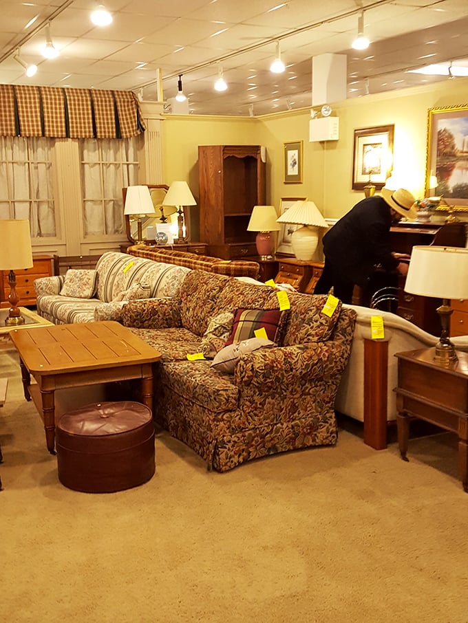 Living room vignettes staged with such homey charm, you half expect to be offered tea and cookies while you contemplate that floral sofa's potential.