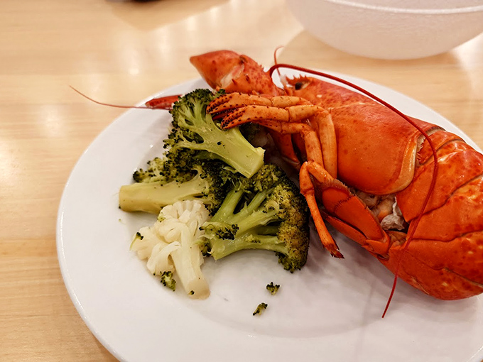 A perfect plate: bright red lobster alongside vibrant broccoli&mdash;proof that sometimes the simplest combinations are the most satisfying.