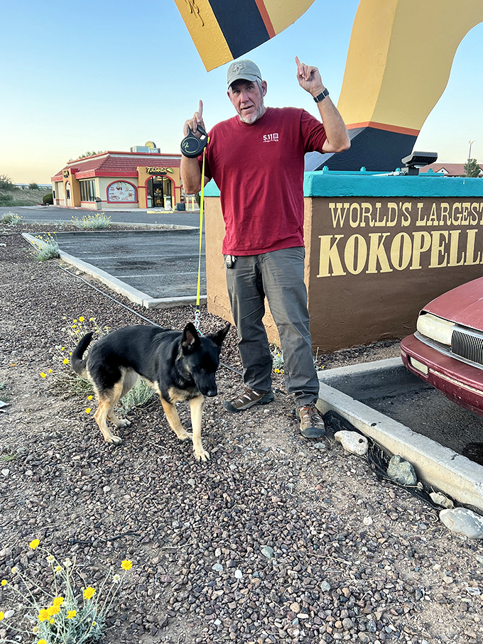 Man's best friend seems unimpressed by mythological celebrity, while his human companion celebrates finding Arizona's most photogenic roadside companion.