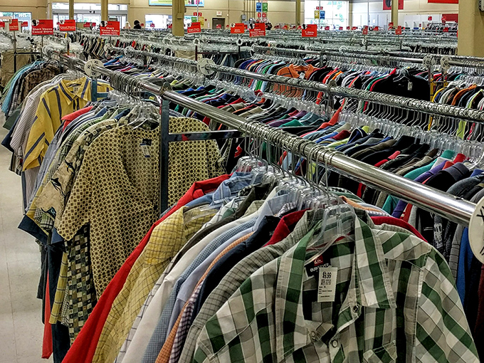 Men's shirts stand at attention, a kaleidoscope of patterns waiting for their second chance. That yellow plaid is practically screaming "Try me on!"