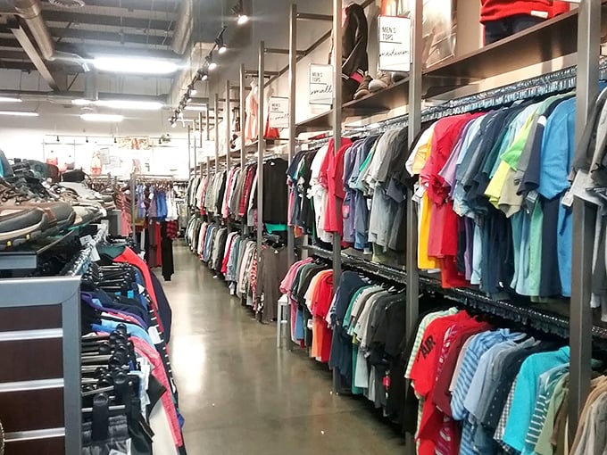 Color-coded clothing nirvana! The organization here would make Marie Kondo weep with joy – everything sparks joy, especially the price tags.