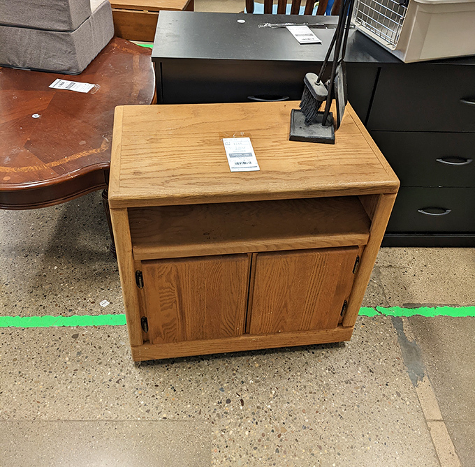 Solid wood furniture with character that puts particle-board assembly kits to shame. This nightstand has probably witnessed more bedtime stories than most librarians.