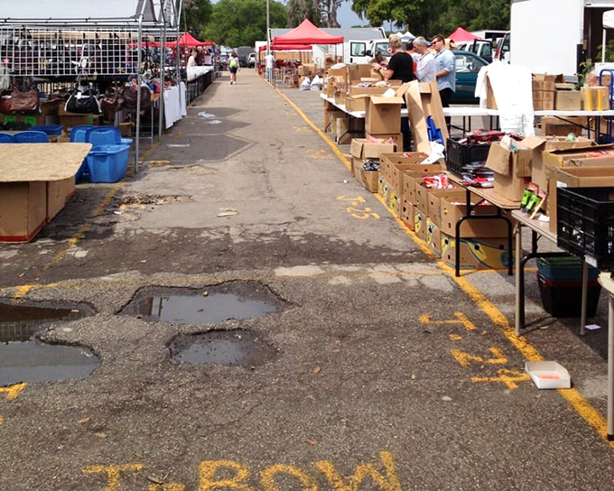 The main drag after a Florida shower. Even puddles can't dampen the enthusiasm of dedicated shoppers on a mission for Monday morning finds.