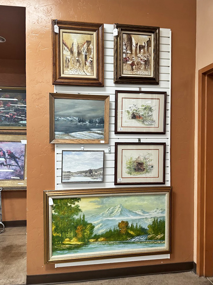 The art wall showcases everything from amateur landscapes to vintage prints. Your empty wall space is practically begging for that mountain scene.