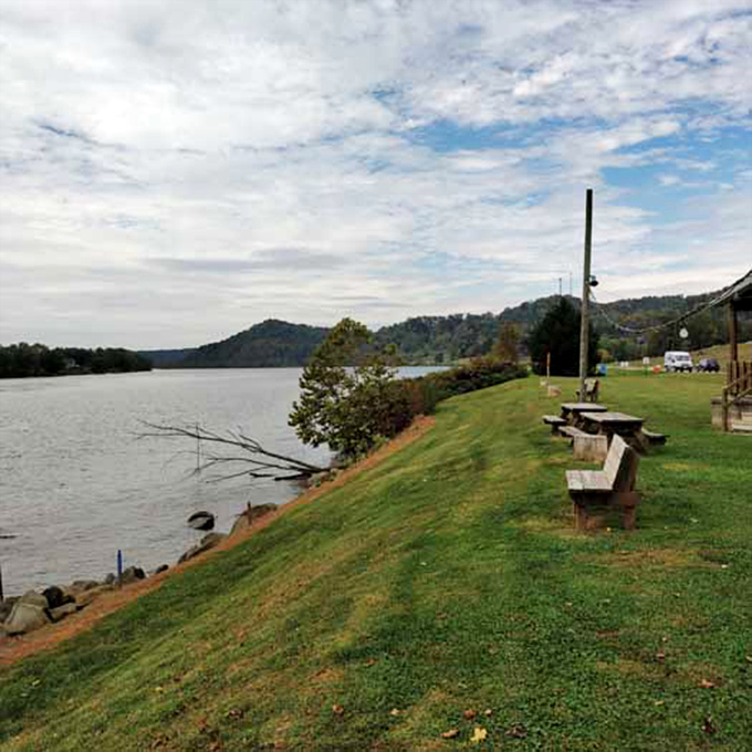 Simple wooden benches offering million-dollar views&mdash;the kind of riverside real estate where conversations and sandwiches both taste better. 