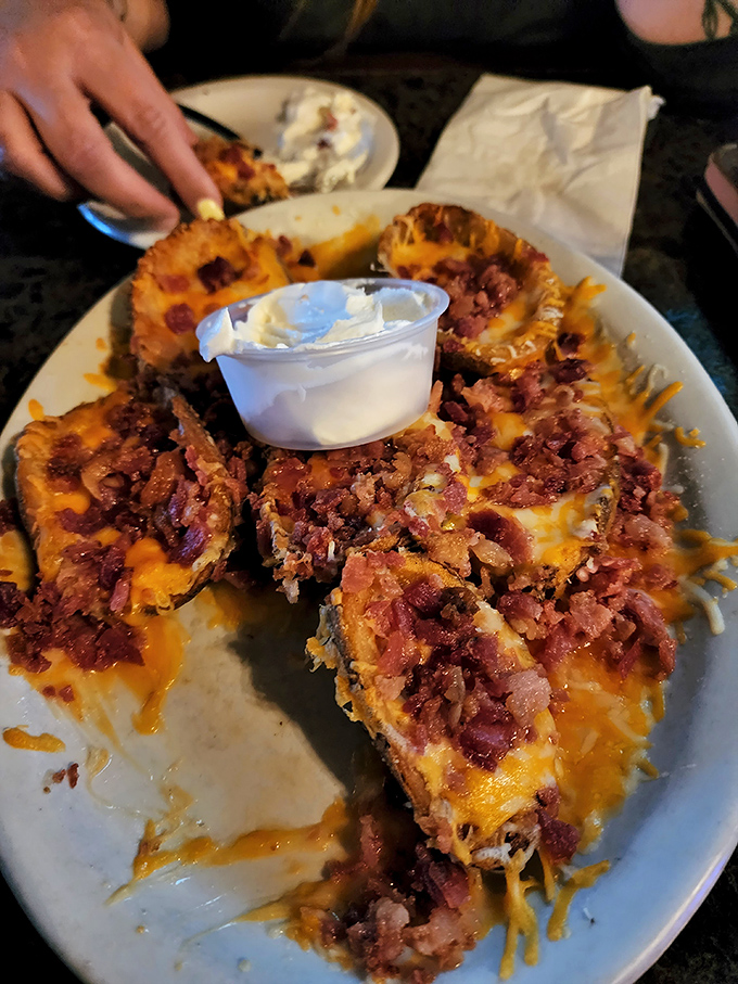 Forget everything else; these fully loaded, gooey potato skins with bacon and cheese are a plate of glorious, cheesy indulgence.
