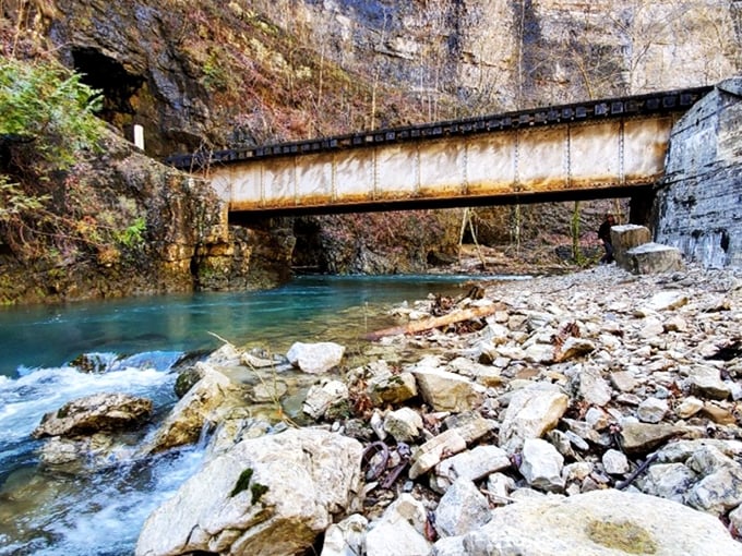 Where engineering meets wilderness &ndash; this weathered railroad bridge spans the crystal waters below, telling stories of countless journeys through the mountains. 