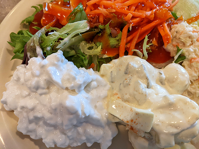 A symphony of textures on one plate&mdash;creamy cottage cheese, crisp salad, and what appears to be the world's most perfect potato salad. 