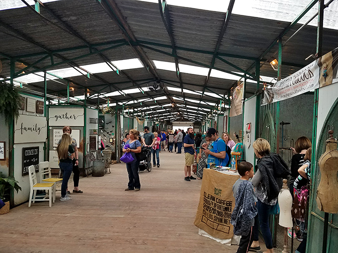 The indoor market hums with excitement as shoppers hunt for treasures beneath the rustic beams, proving junking is truly a spectator sport.