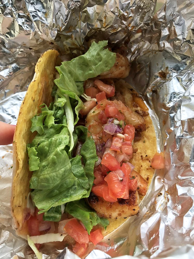 Fresh shrimp nestled in a golden tortilla with crisp lettuce and pico de gallo&mdash;Florida's coastal bounty in every bite.