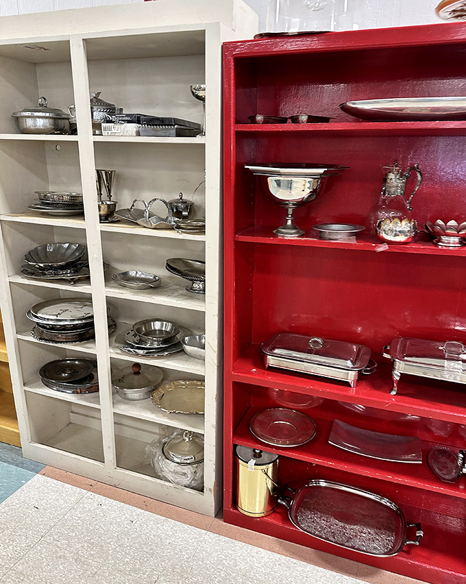 Silver serving pieces that have graced countless holiday tables now wait for new celebrations. That red cabinet could tell stories of dinners past.