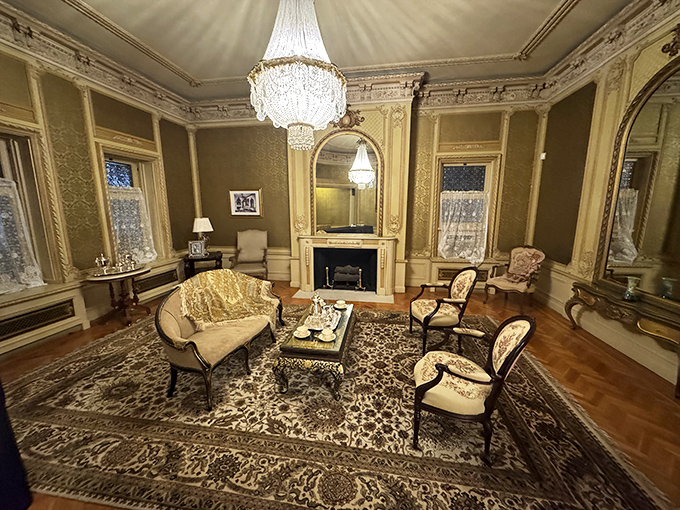 Downton Abbey called&mdash;they want their drawing room back. Gold accents and period furniture transport visitors to a more elegant era.