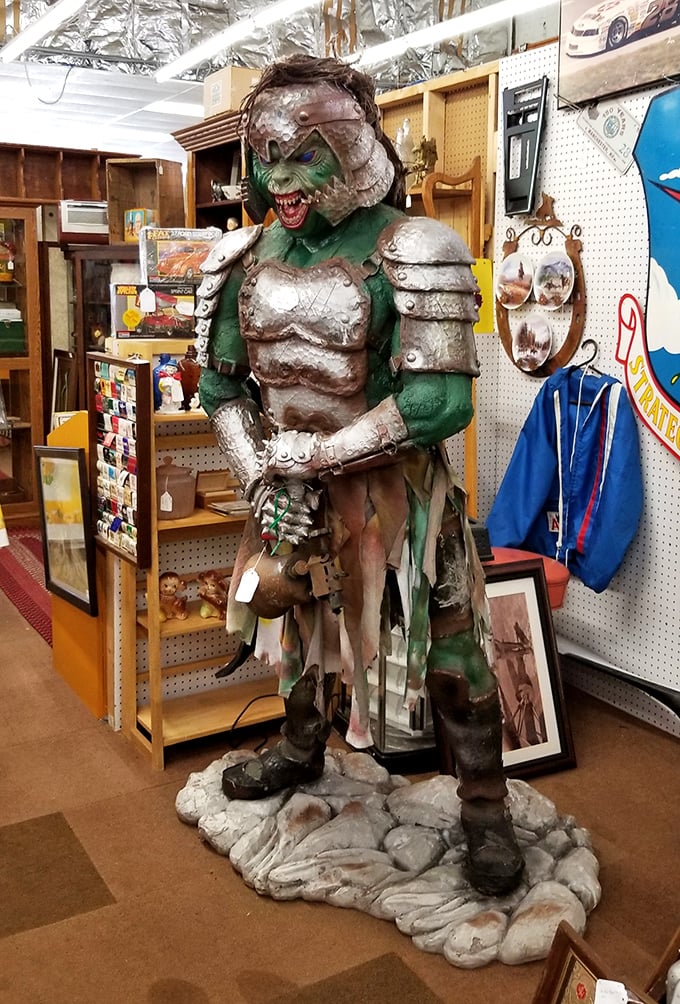 Not all treasures are small! This imposing fantasy creature stands guard over vintage collectibles like a bouncer at the world's most eclectic nightclub.