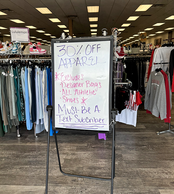 The whiteboard of savings announces "30% OFF" like a town crier of thrift. Text subscribers get the royal treatment in this kingdom of deals.
