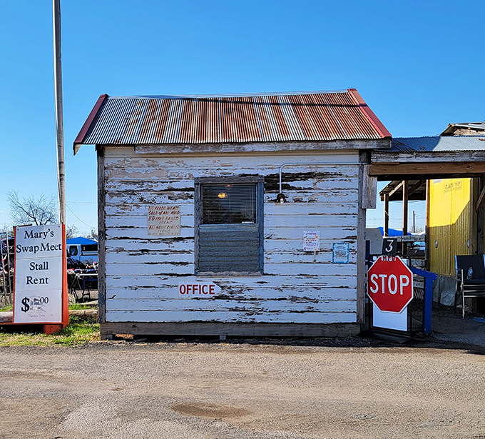 Command central! This weathered office has witnessed thousands of deals, with its rustic charm serving as the swap meet's beating heart.