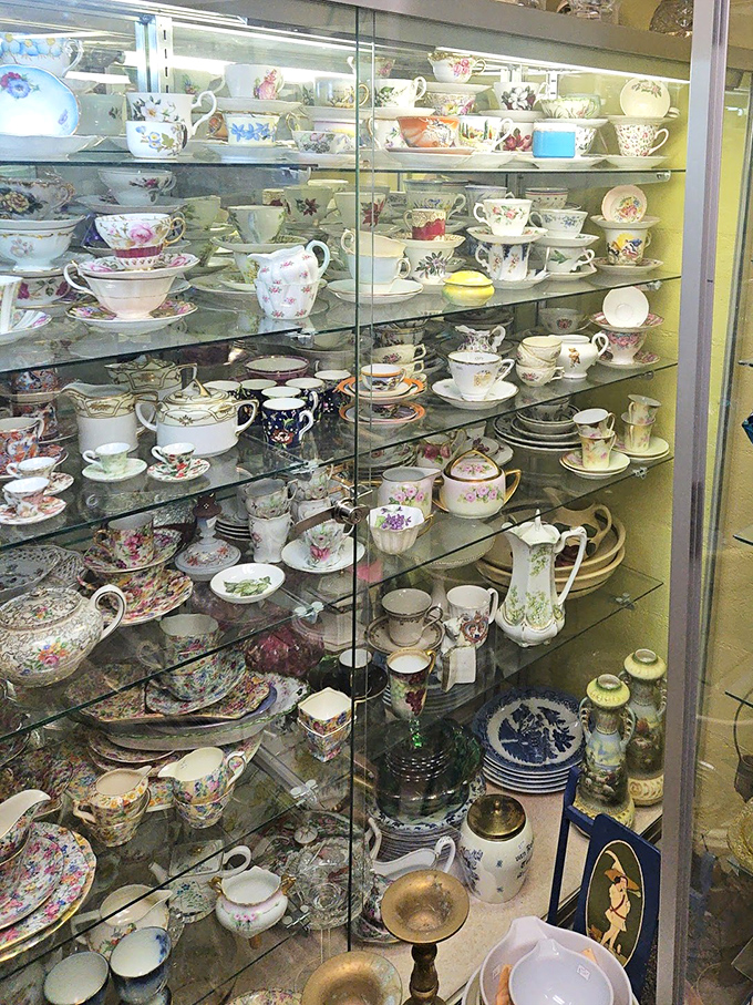 Teacups behind glass whisper stories of countless afternoon teas, gossip sessions, and proper pinky positioning through the decades.