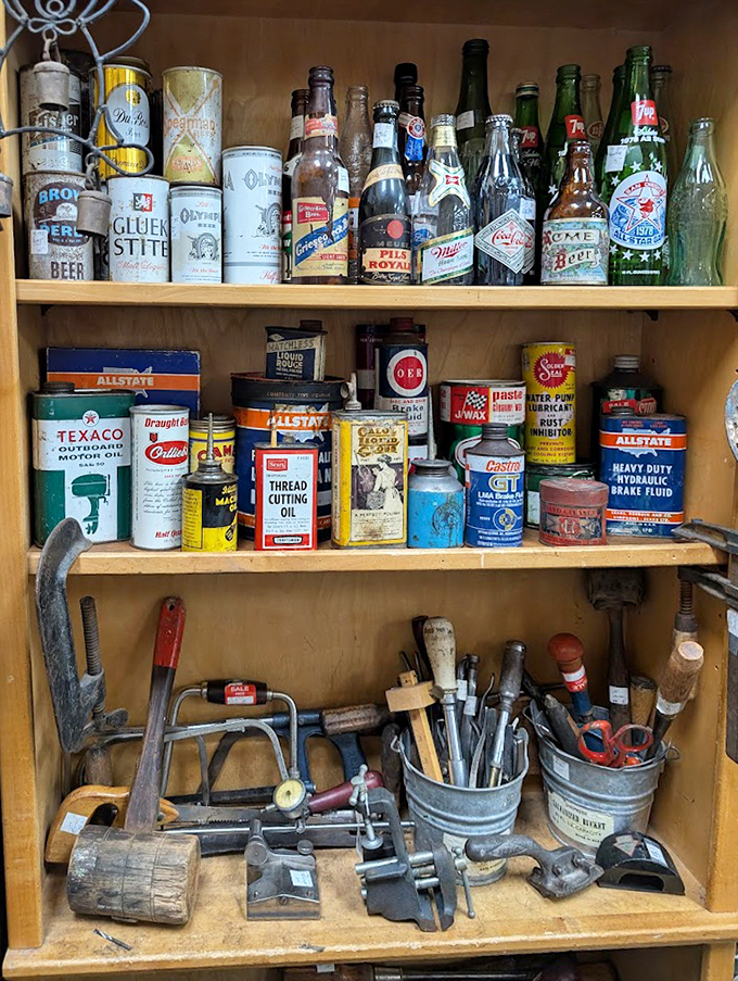 The holy trinity of vintage Americana: old tools, classic beverage containers, and automotive memorabilia. Every garage-proud dad's dream collection in one cabinet.