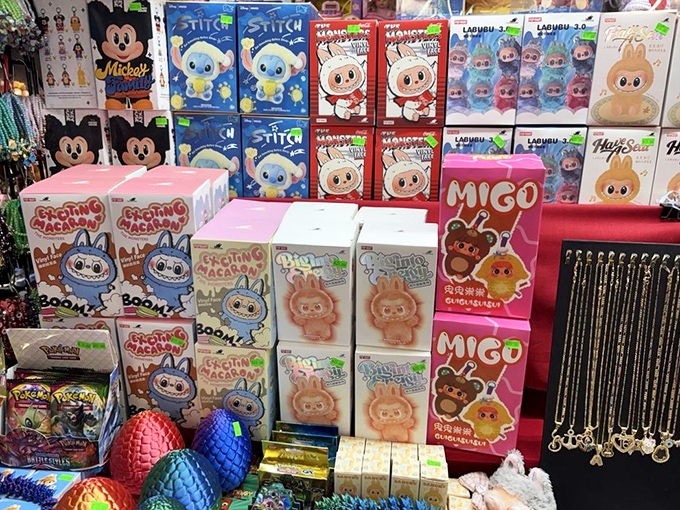 Cute character toys line these shelves like a United Nations of Adorable. Your inner child is already reaching for your wallet.