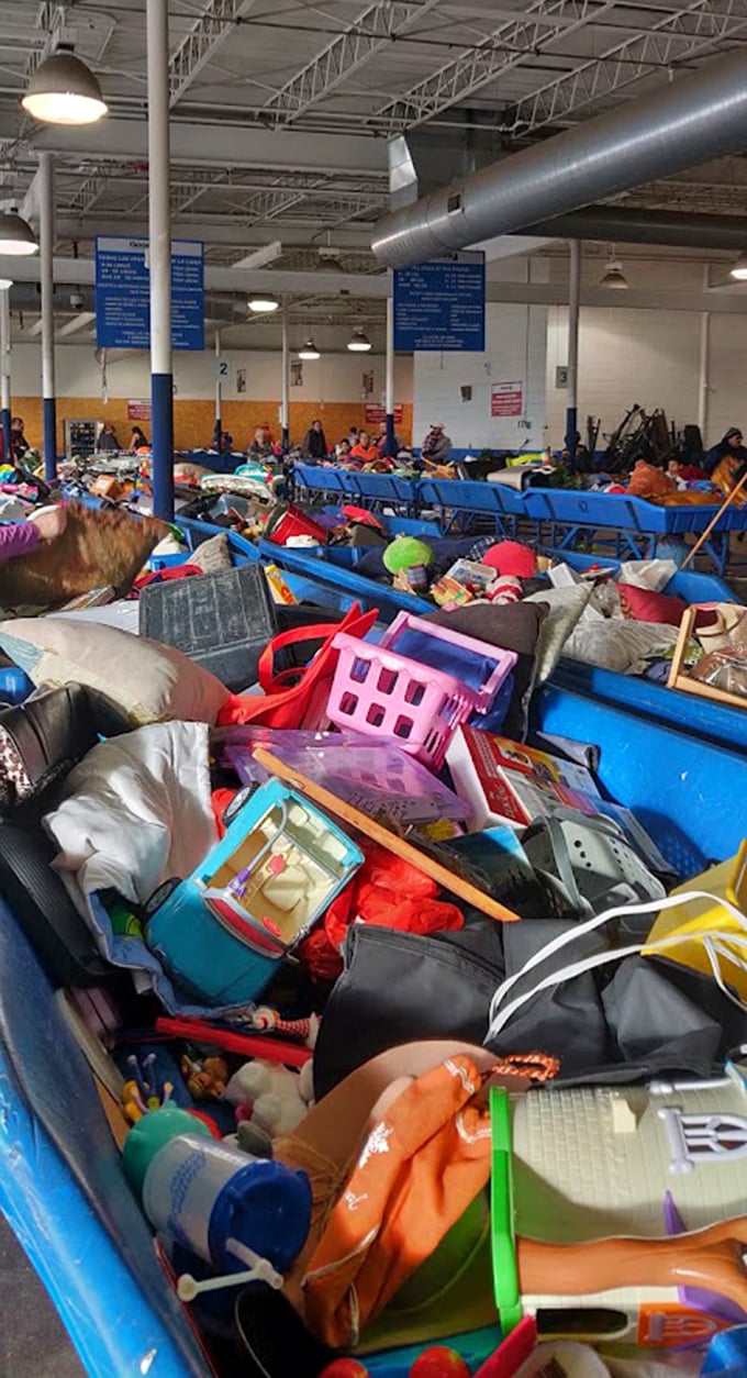 Organized chaos at its finest. Each blue bin contains multiverses of possibility&mdash;from children's toys to kitchen gadgets that time forgot.