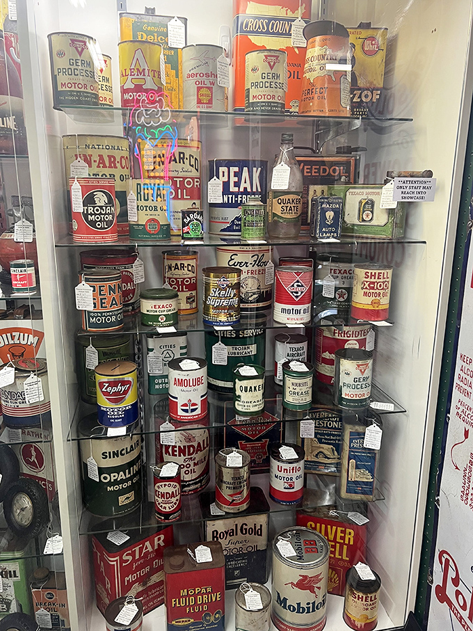 A petroleum rainbow of vintage motor oil cans&mdash;automotive history preserved in tin, when brands like Kendall and Texaco were roadside royalty.