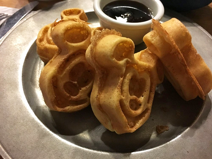 Mickey-shaped waffles: where childhood nostalgia meets adult-sized hunger in a golden-brown masterpiece that's begging for maple syrup's sweet embrace.