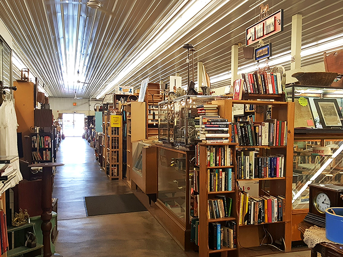 This massive indoor space stretches like a small town built entirely from antique booths and vintage treasure displays.